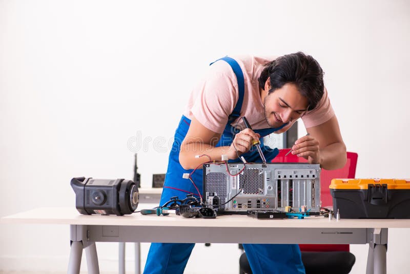 The Young Male Contractor Repairing Computer Stock Image - Image of ...