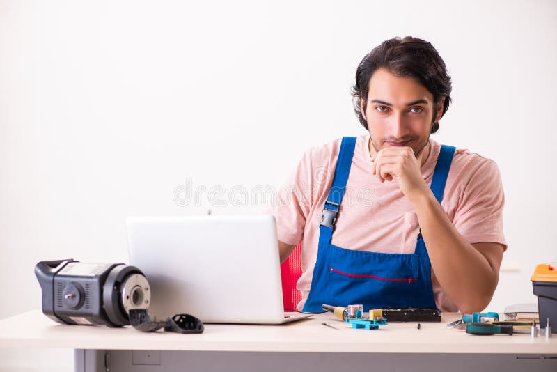 The Young Male Contractor Repairing Computer Stock Photo - Image of ...