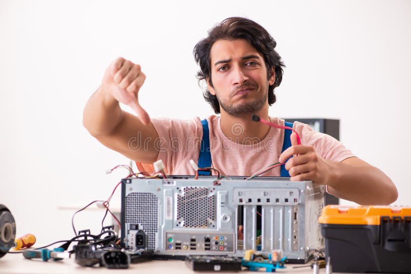The Young Male Contractor Repairing Computer Stock Photo - Image of ...