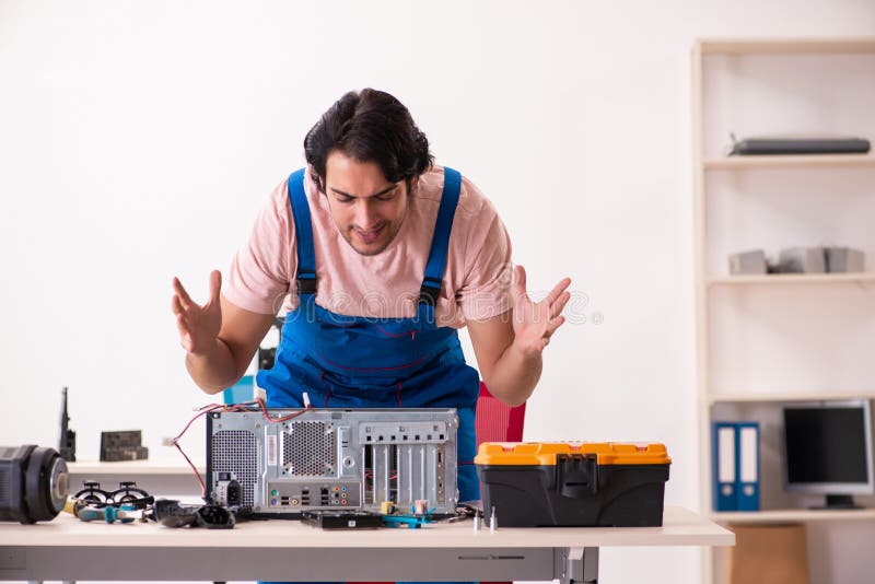 The Young Male Contractor Repairing Computer Stock Image - Image of ...