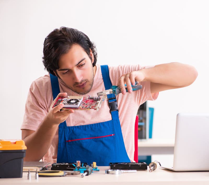 The Young Male Contractor Repairing Computer Stock Image - Image of ...