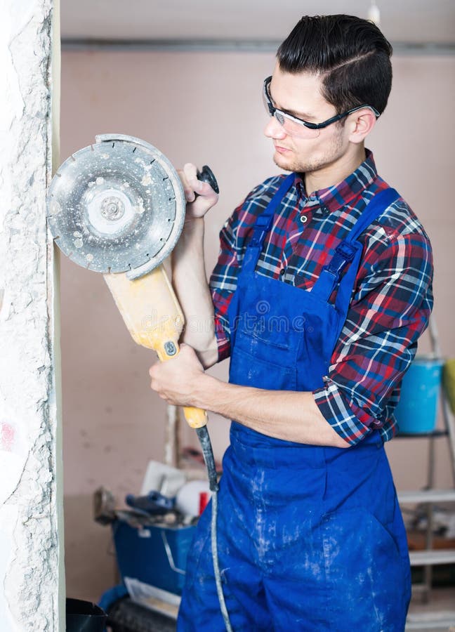 Male Contractor Using Professional Angle Grinder Stock Image - Image of ...