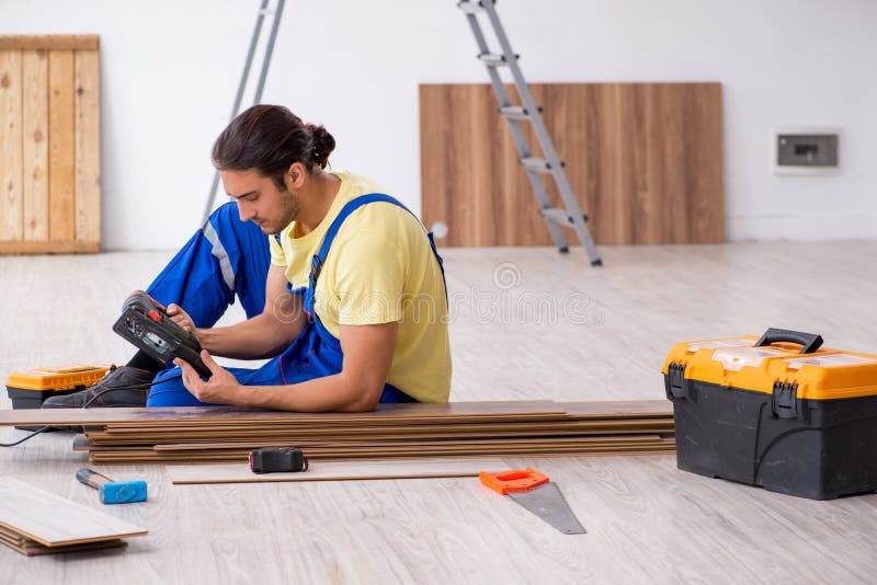 Young Male Contractor Working Indoors Stock Photo - Image of repair ...