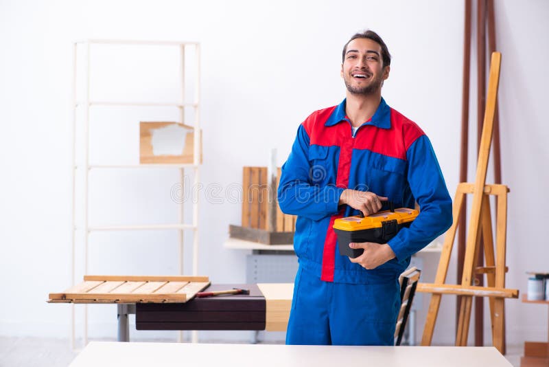 Young Male Contractor Working in Workshop Stock Image - Image of ...