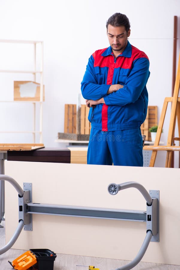 Young Male Contractor Working in Workshop Stock Image - Image of tool ...