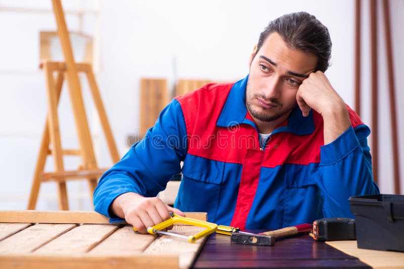 Young Male Contractor Working in Workshop Stock Photo - Image of ...