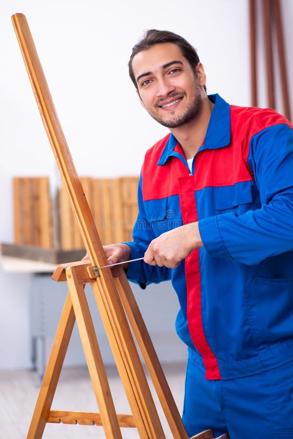 Young Male Contractor Working in Workshop Stock Image - Image of ...