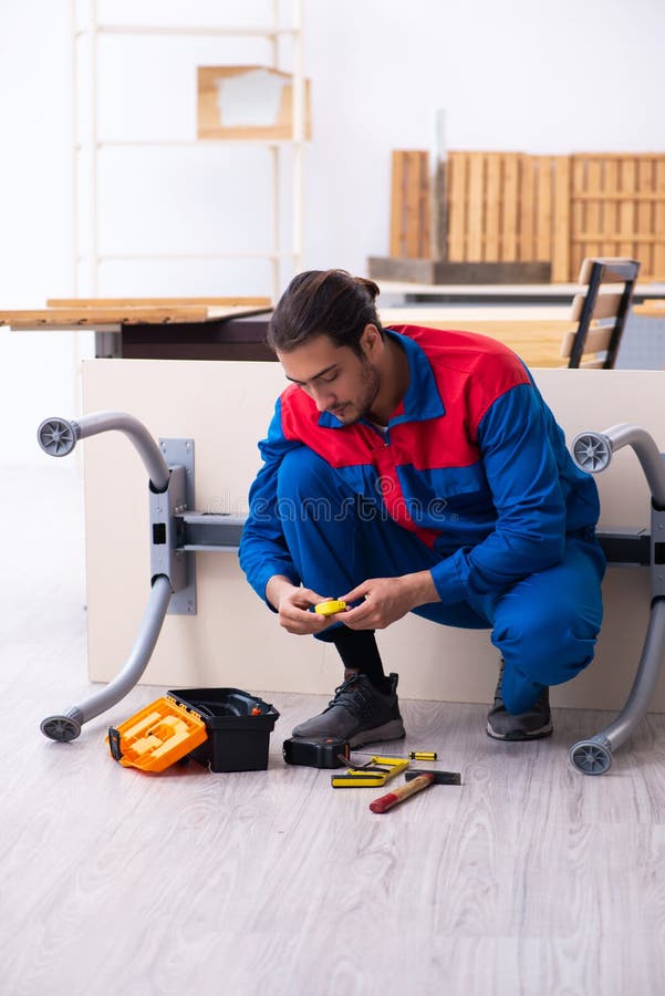 Young Male Contractor Working in Workshop Stock Photo - Image of ...