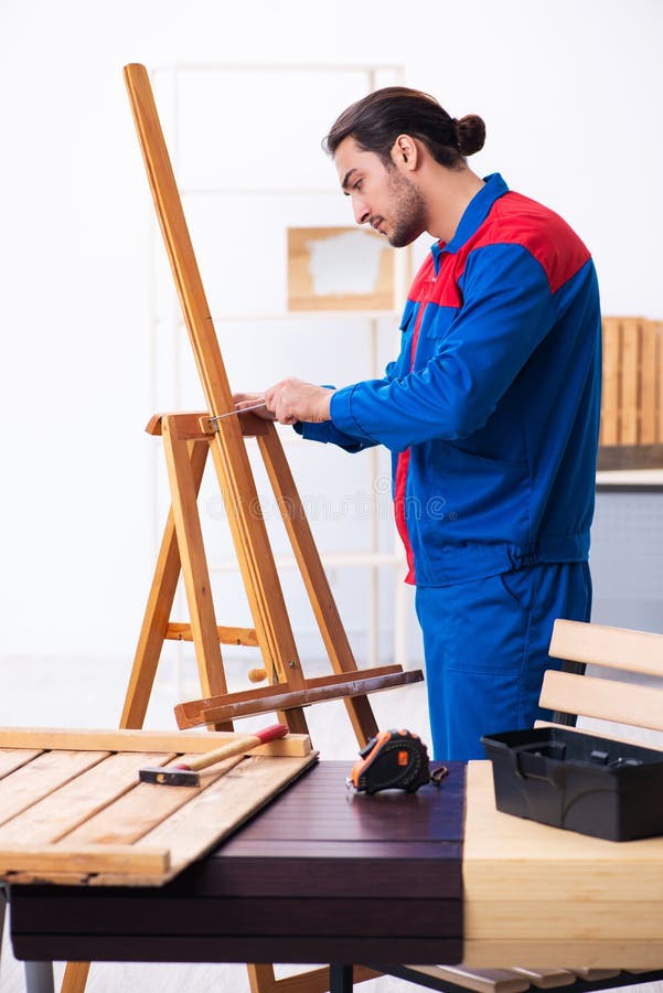 Young Male Contractor Working in Workshop Stock Image - Image of ...