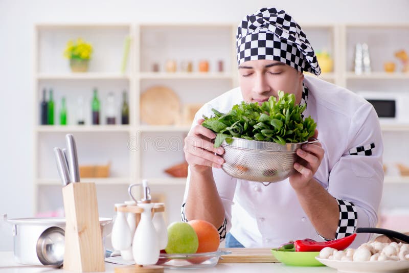 The Young Male Cook Working in the Kitchen Stock Photo - Image of ...