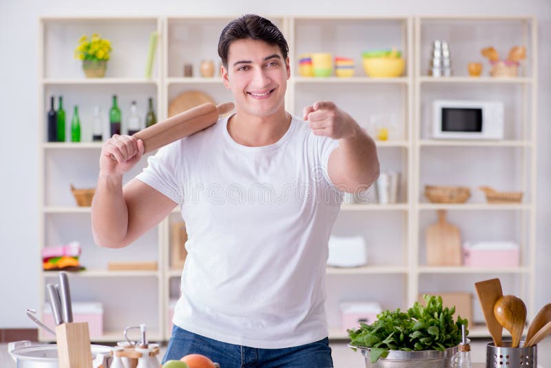The Young Male Cook Working in the Kitchen Stock Image - Image of ...