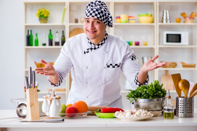 The Young Male Cook Working in the Kitchen Stock Image - Image of knife ...