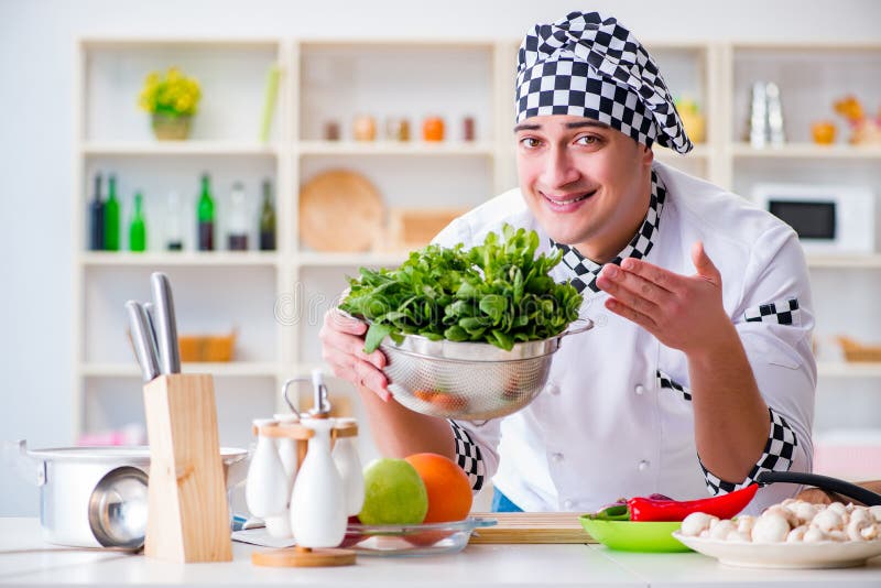 The Young Male Cook Working in the Kitchen Stock Photo - Image of meal ...