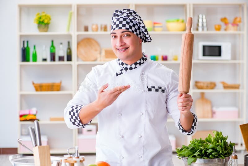 The Young Male Cook Working in the Kitchen Stock Photo - Image of ...