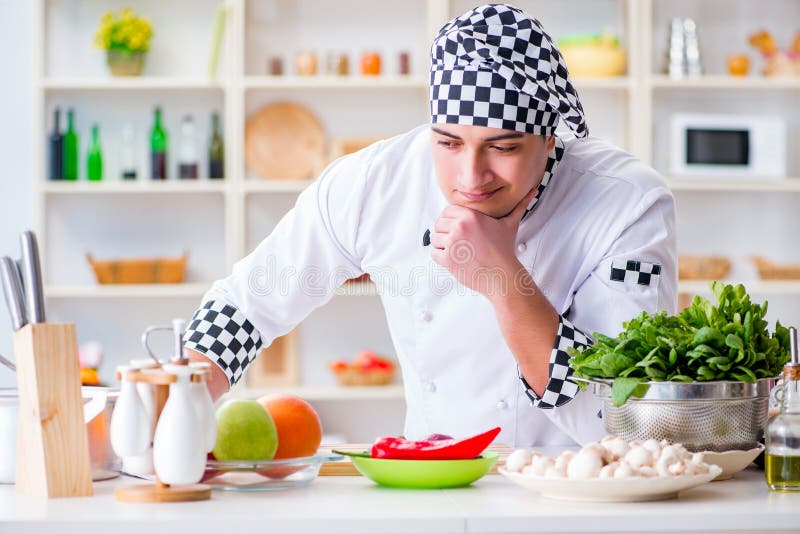 The Young Male Cook Working in the Kitchen Stock Photo - Image of knife ...