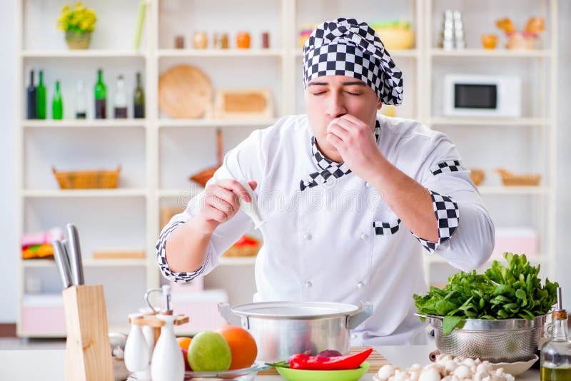 The Young Male Cook Working in the Kitchen Stock Photo - Image of male ...