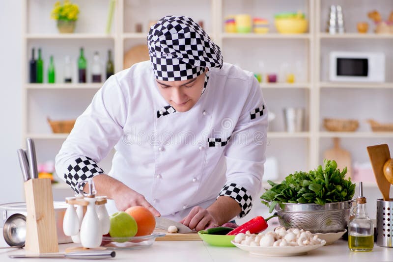 The Young Male Cook Working in the Kitchen Stock Image - Image of green ...