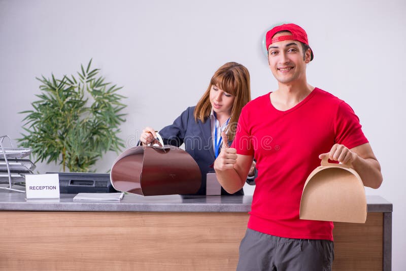 Young Male Courier Delivering Cake To Hotel`s Reception Stock Image ...