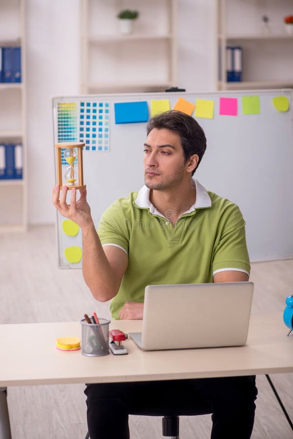 Young Male Designer in Time Management Concept Stock Photo - Image of ...