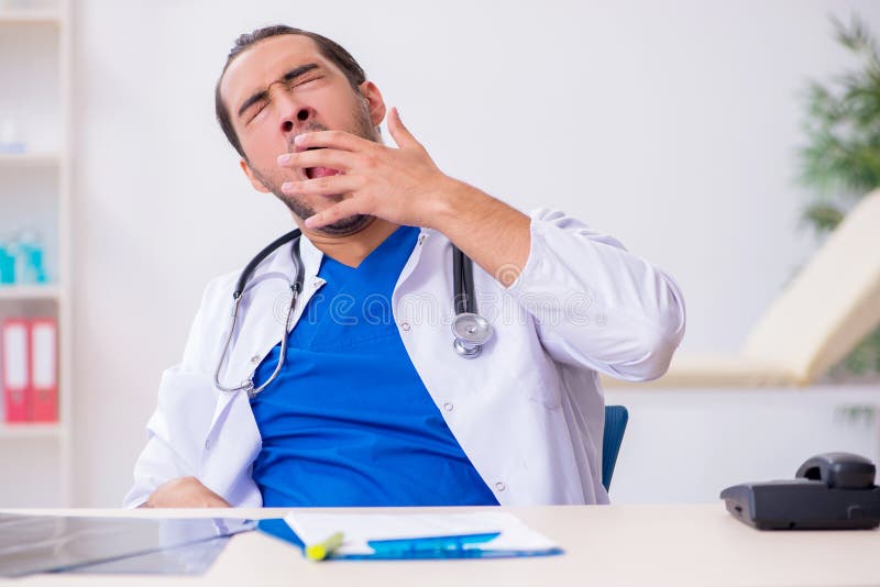 Young Male Doctor Being Tired after Night Shift Stock Photo - Image of ...