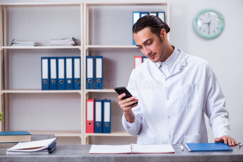 Young Male Doctor at the Reception in the Hospital Stock Photo - Image ...