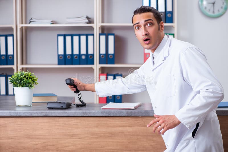 Young Male Doctor at the Reception in the Hospital Stock Image - Image ...