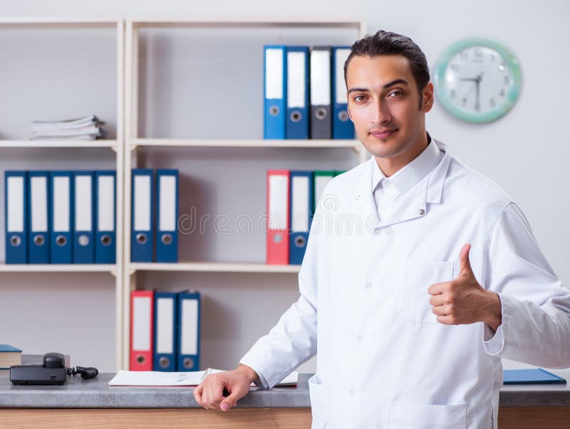 Young Male Doctor at the Reception in the Hospital Stock Image - Image ...