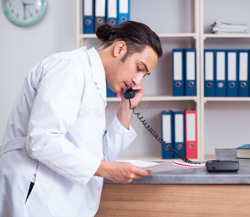 Young Male Doctor at the Reception in the Hospital Stock Image - Image ...