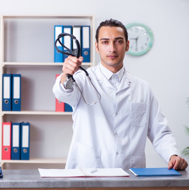 Young Male Doctor at the Reception in the Hospital Stock Image - Image ...