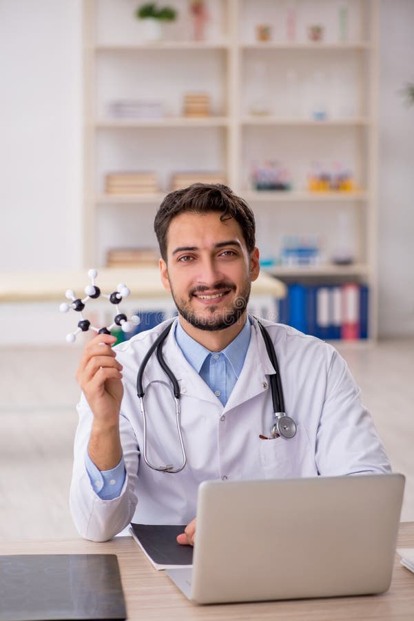 Young Male Doctor Studying Molecular Model Stock Photo - Image of care ...