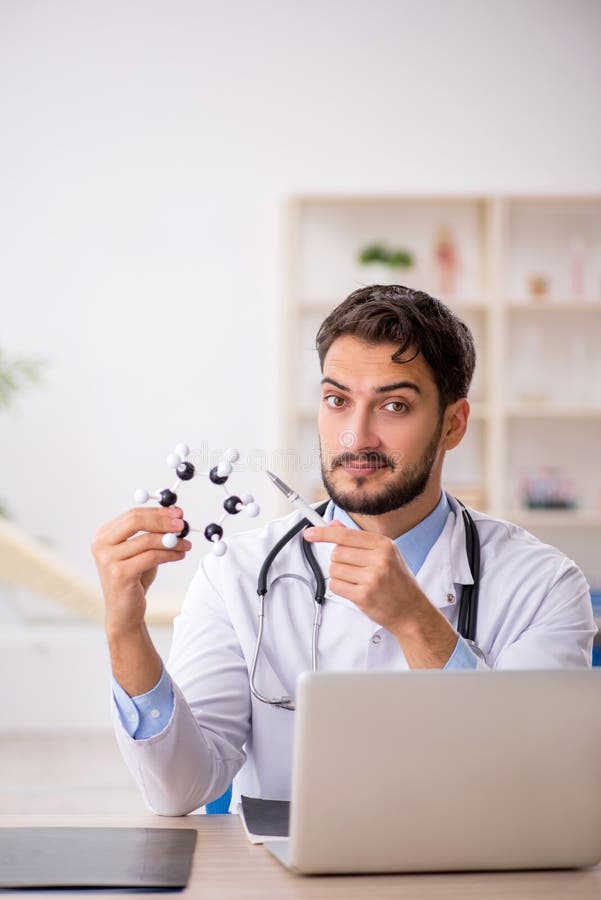 Young Male Doctor Studying Molecular Model Stock Photo - Image of ...