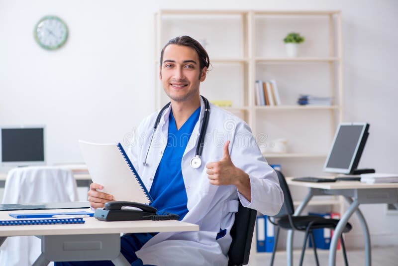 Young Male Doctor Working in the Clinic Stock Photo - Image of clinic ...