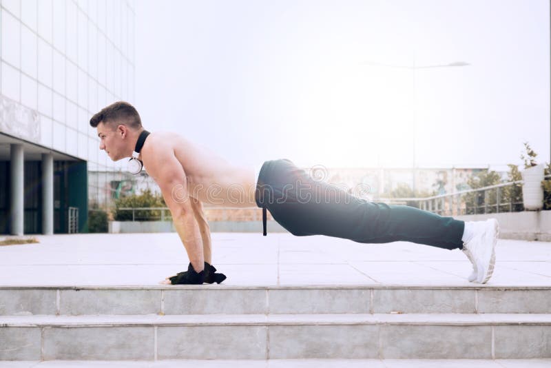 Young Male Doing Push Ups in Front of the Modern Sport Center. S Stock ...