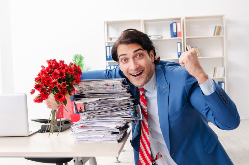 Young Male Employee with Bunch of Flowers in the Office Stock Image ...