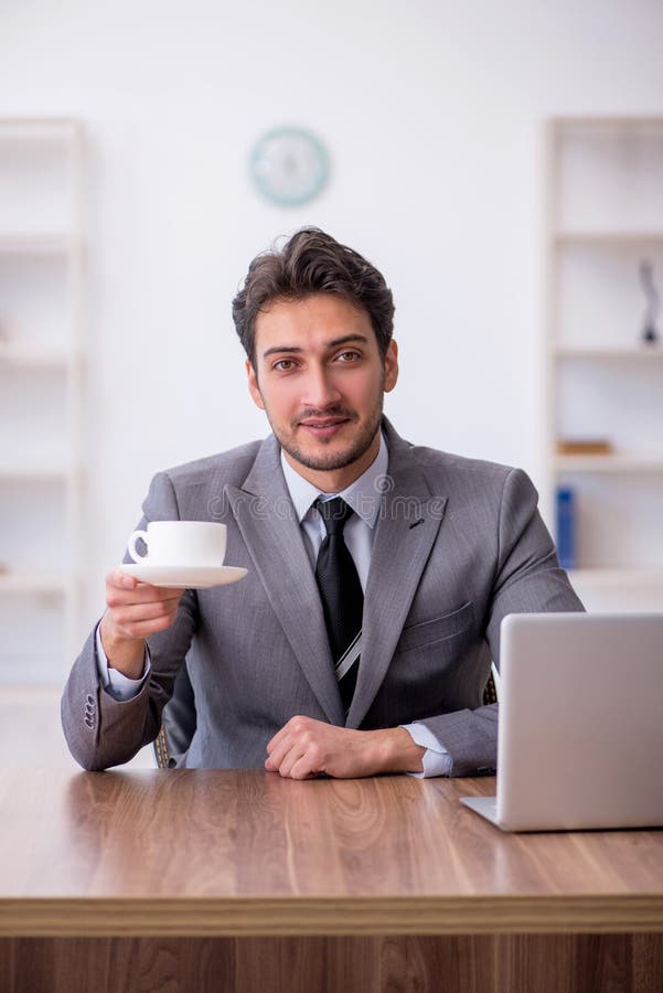 Young Male Employee Drinking Coffee during Break Stock Photo - Image of ...