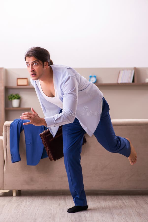 Young Male Employee Getting Up Late at Home Stock Image - Image of ...