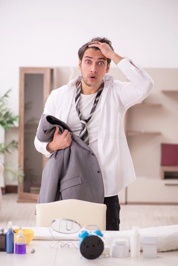 Young Male Employee Getting Up Late at Home Stock Photo - Image of ...