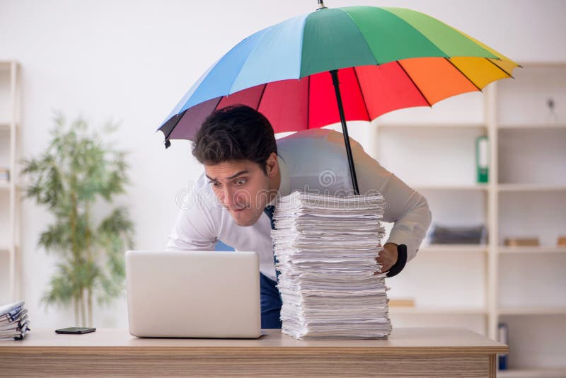Young Male Employee Holding an Umbrella in the Office Stock Image ...
