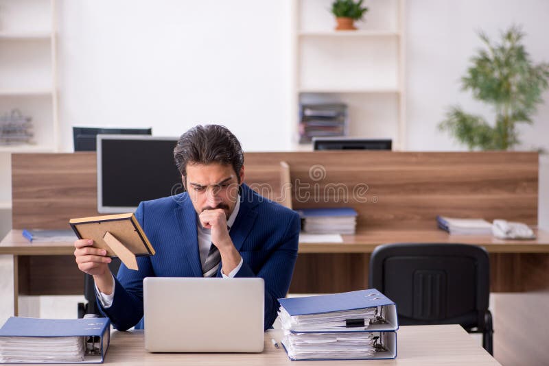 Young Male Employee Missing Girlfriend at Workplace Stock Photo - Image ...