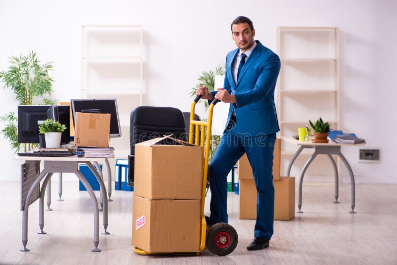 Young Male Employee in Moving Concept Stock Photo - Image of boxes ...
