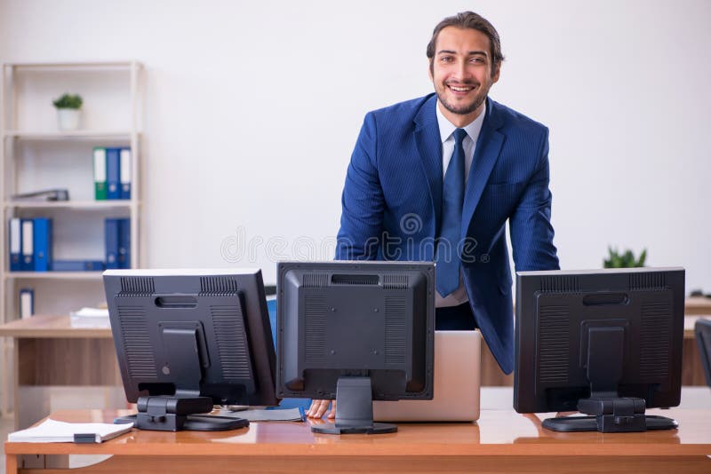 Young Male Employee in Multitasking Concept Stock Photo - Image of boss ...