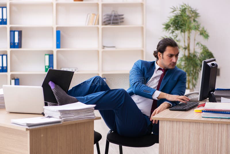 Young Male Employee in Multitasking Concept Stock Image - Image of ...