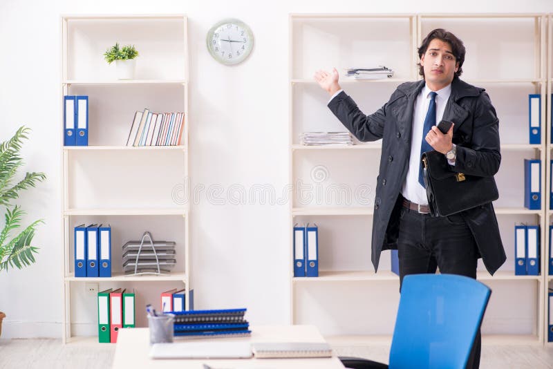 Young Male Employee in the Office in Time Management Concept Stock ...