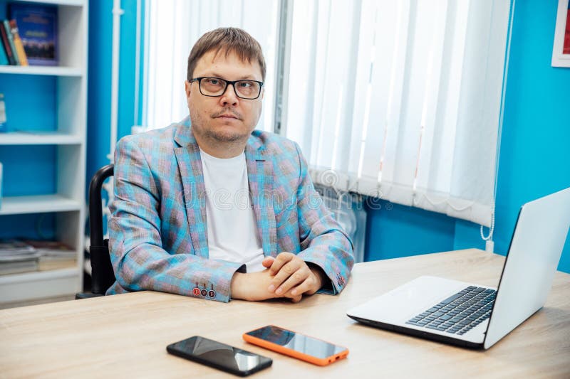 Male Employee Reading Book in the Office Stock Photo - Image of ...