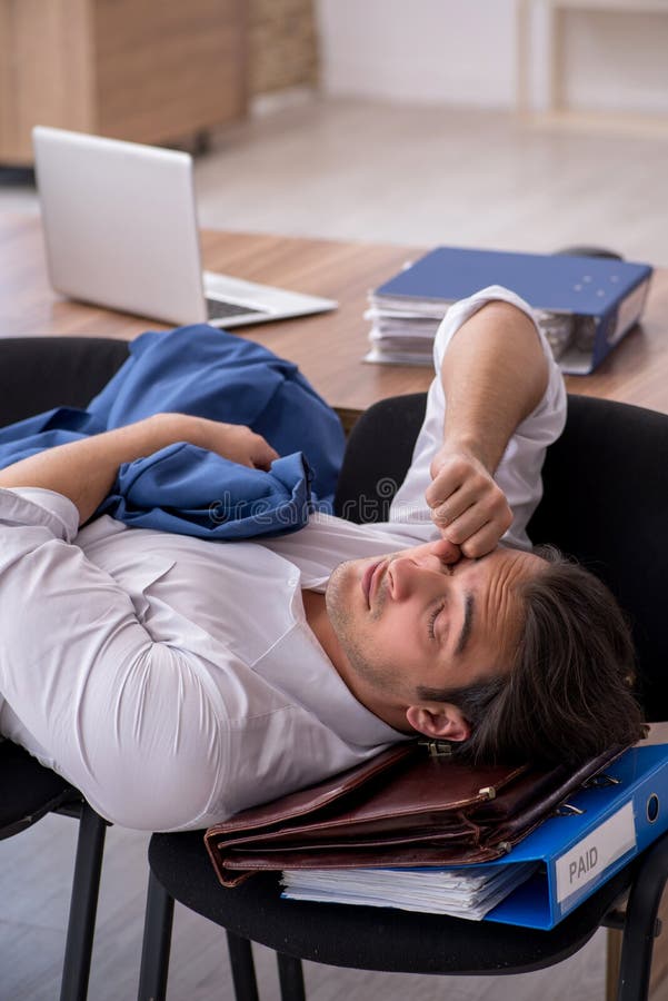 Young Male Employee Sleeping in the Office on Chairs Stock Image ...