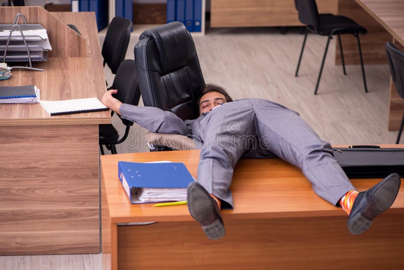 Young Male Employee Sleeping at Workplace Stock Photo - Image of break ...