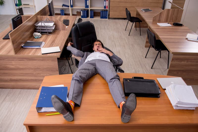 Young Male Employee Sleeping at Workplace Stock Photo - Image of ...