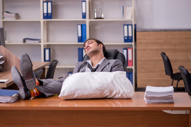 Young Male Employee Sleeping at Workplace Stock Photo - Image of ...