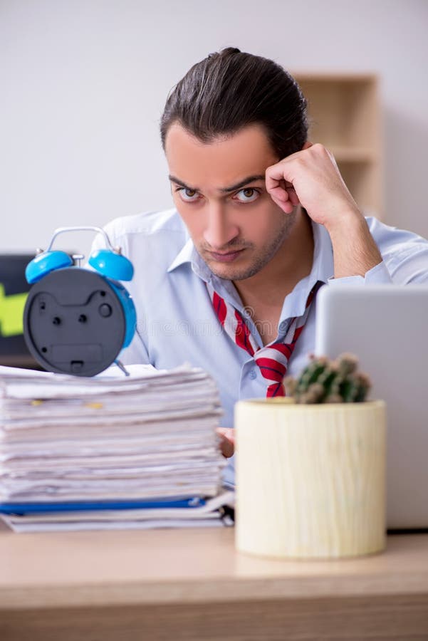 Young Male Employee in Time Management Concept Stock Photo - Image of ...