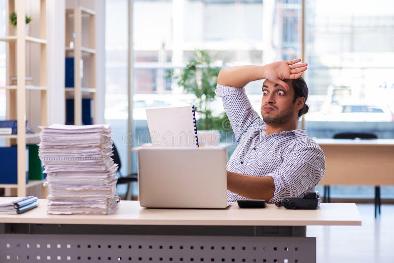Young Male Employee Unhappy with Excessive Work in the Office Stock ...